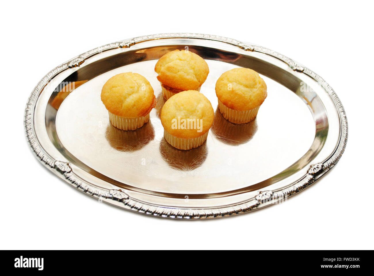 Four Corm Muffins Served on a Silver Tray Stock Photo - Alamy