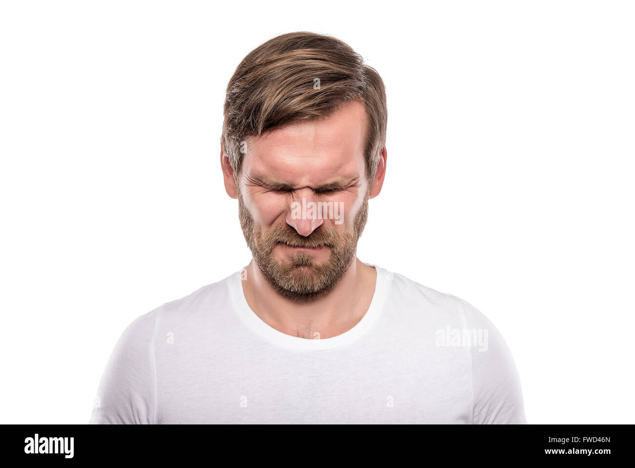 Stressful young man isolated on white background Stock Photo - Alamy