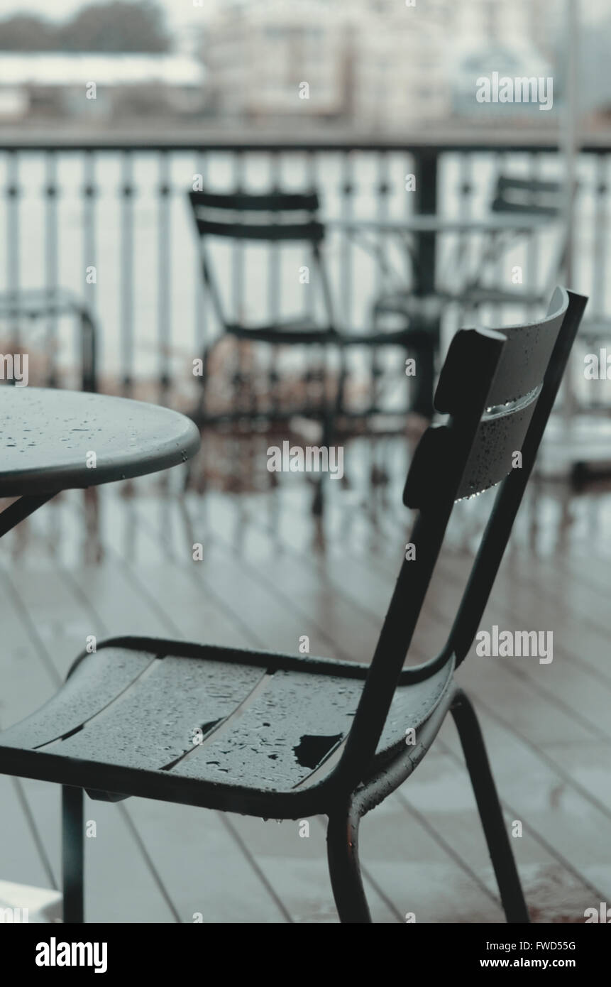 Black Chair In The Rain Is Outdoor at Balcony Stock Photo - Alamy