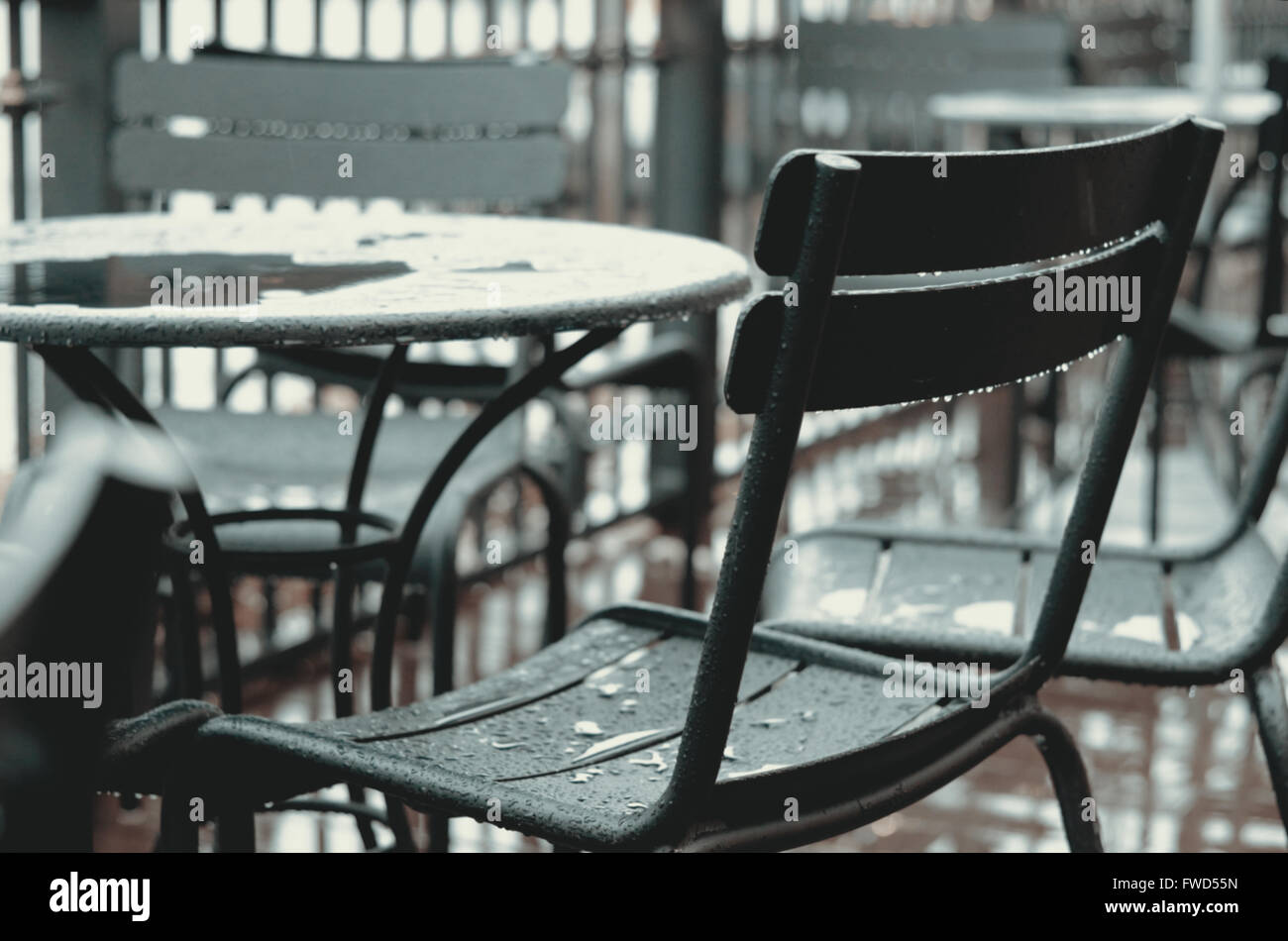 Black Chair In The Rain Is Outdoor at Balcony Stock Photo - Alamy
