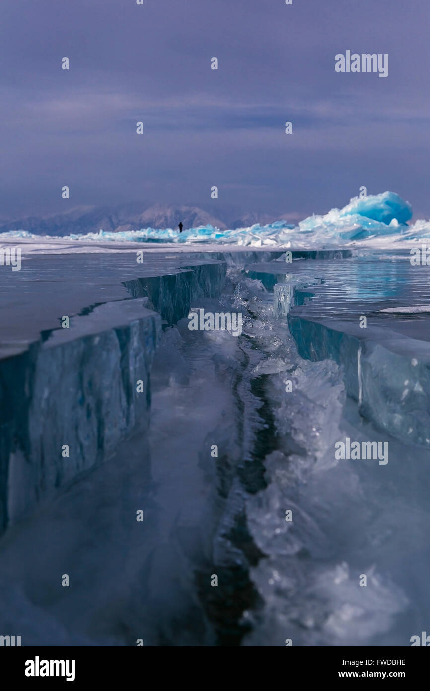 Large cracks on surface of the ice Stock Photo - Alamy