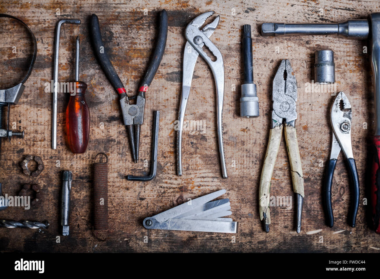 Color image of many tools on a wooden plank Stock Photo - Alamy