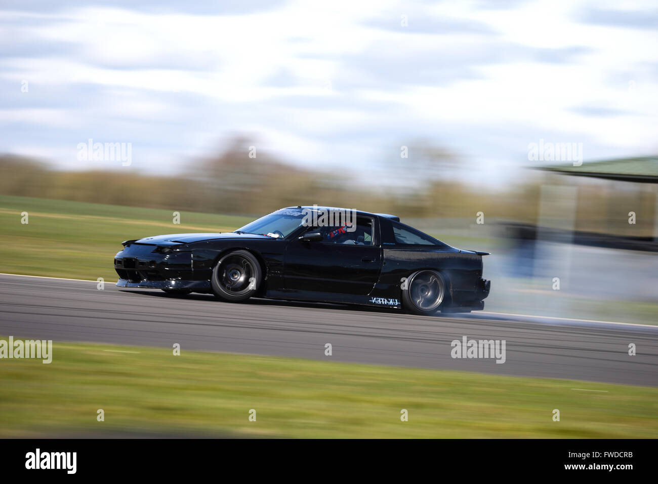 A drift car on track at Castle Combe Circuit Stock Photo - Alamy