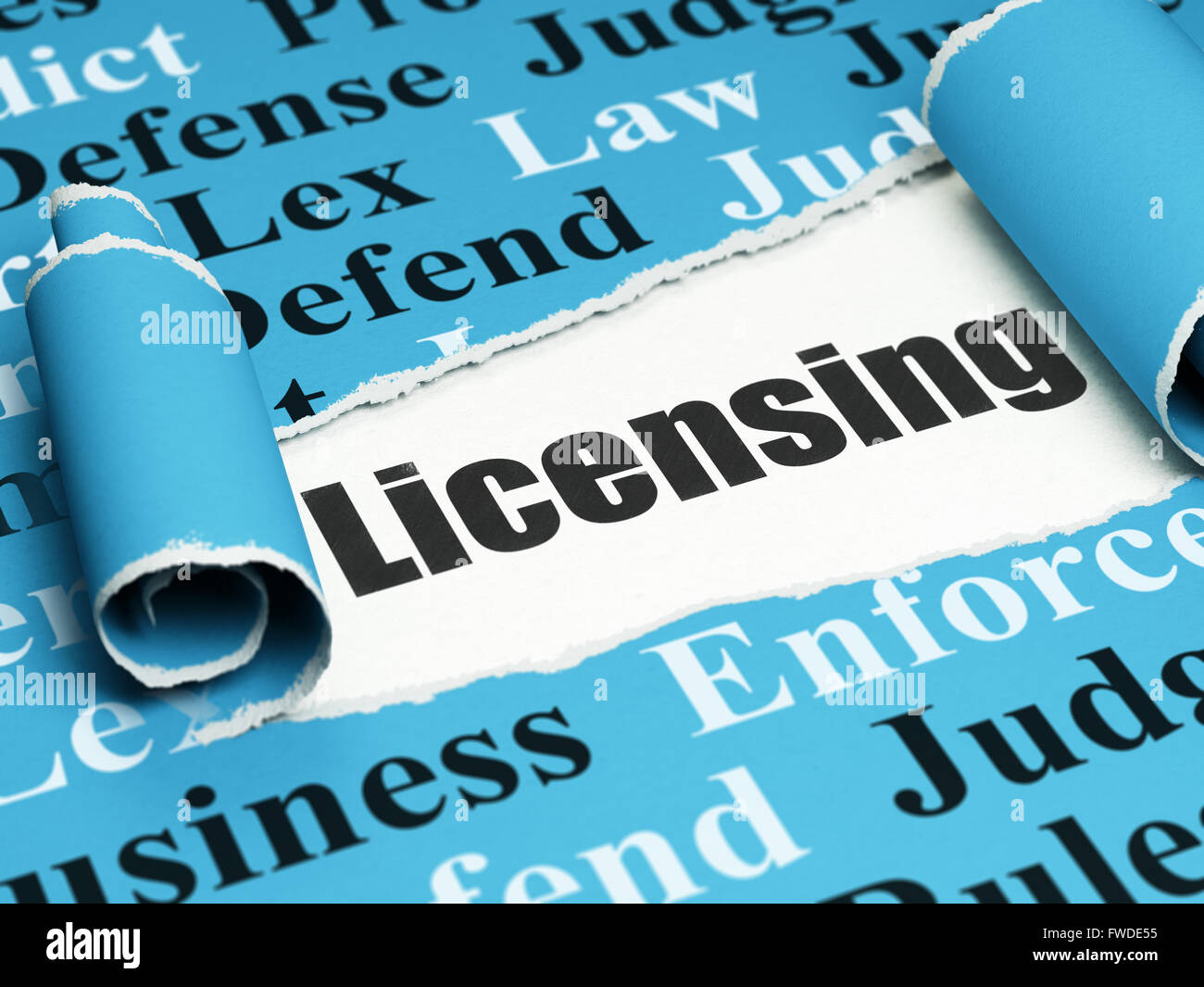 Law concept: black text Licensing under the piece of torn paper Stock ...
