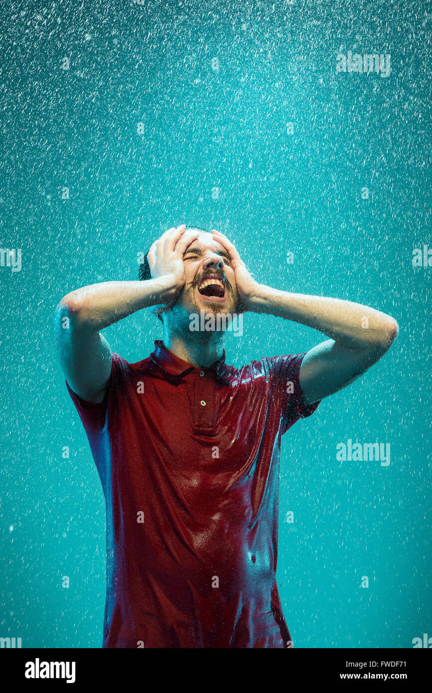 The portrait of young man in the rain Stock Photo - Alamy