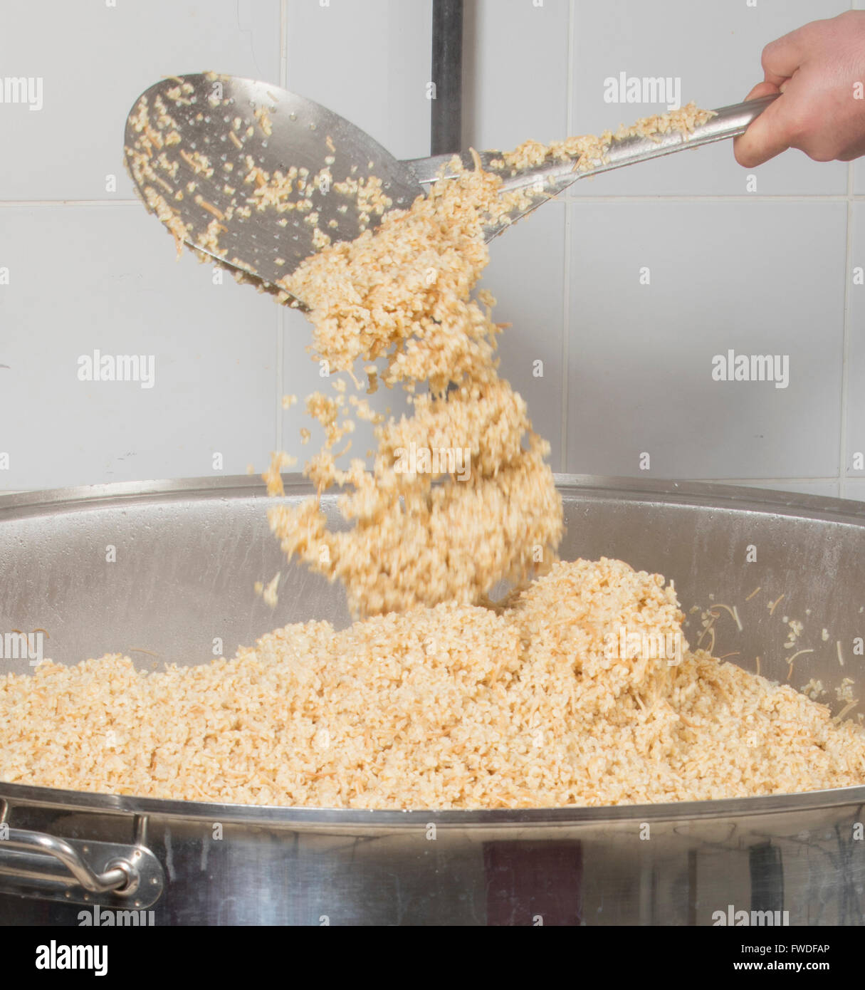 chef cooking rice at a commercial kitchen Stock Photo - Alamy