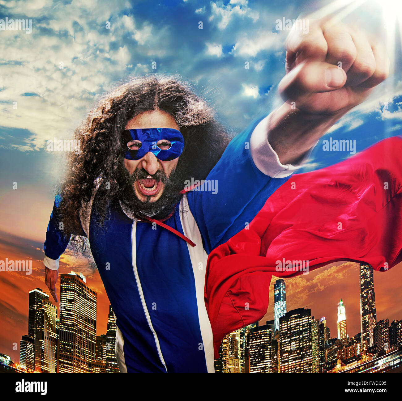 Portrait of a ambitious superhero watching over the city Stock Photo ...