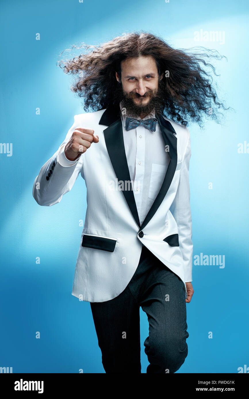 Funny and skinny man wearing a tuxedo Stock Photo - Alamy