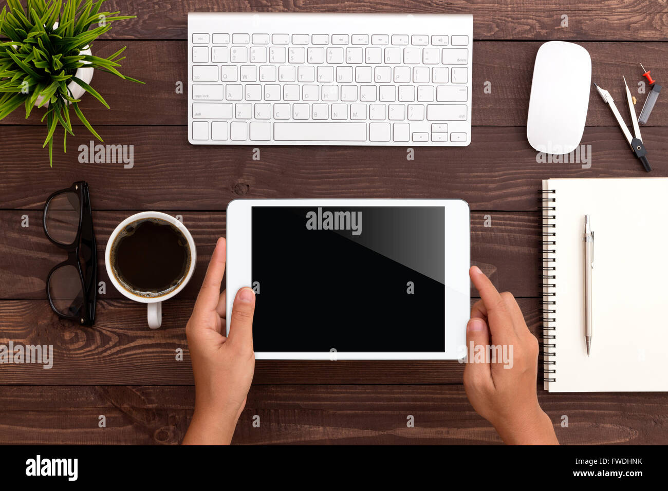 hand using white tablet on workspace Stock Photo - Alamy