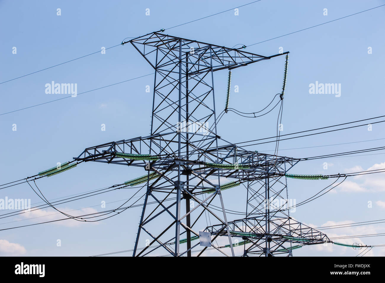high voltage electric power lines on pylons, power transmission tower ...