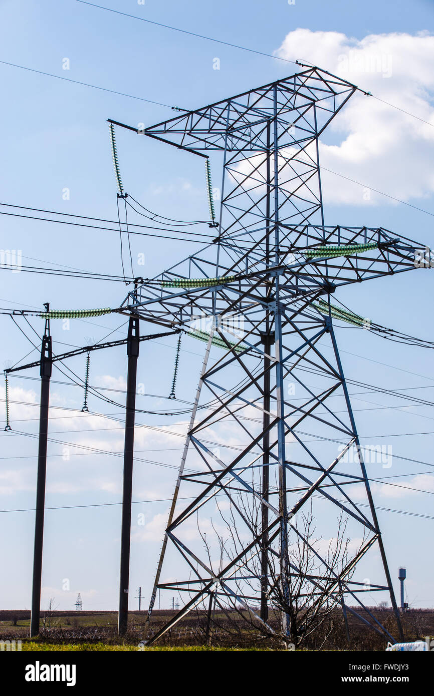 high voltage electric power lines on pylons, power transmission tower ...