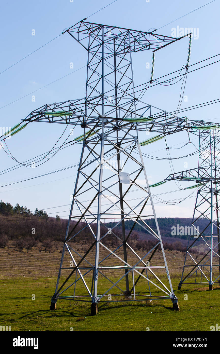 high voltage electric power lines on pylons, power transmission tower ...