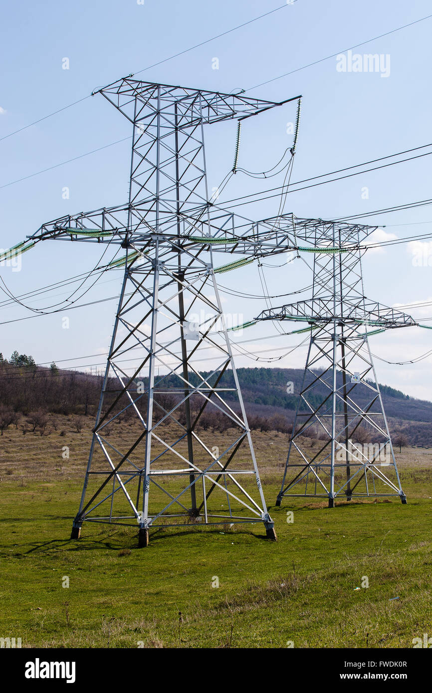 high voltage electric power lines on pylons, power transmission tower ...
