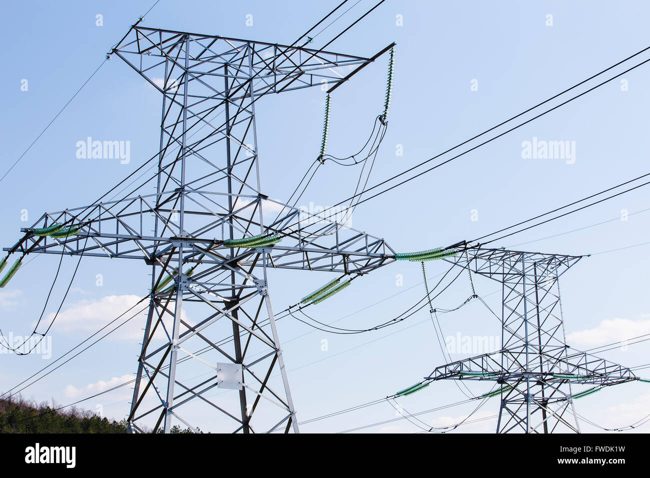 high voltage electric power lines on pylons, power transmission tower ...