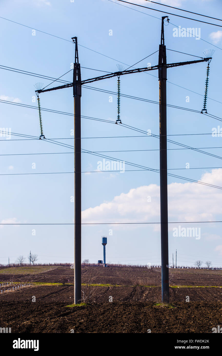 high voltage electric power lines on pylons, power transmission tower ...