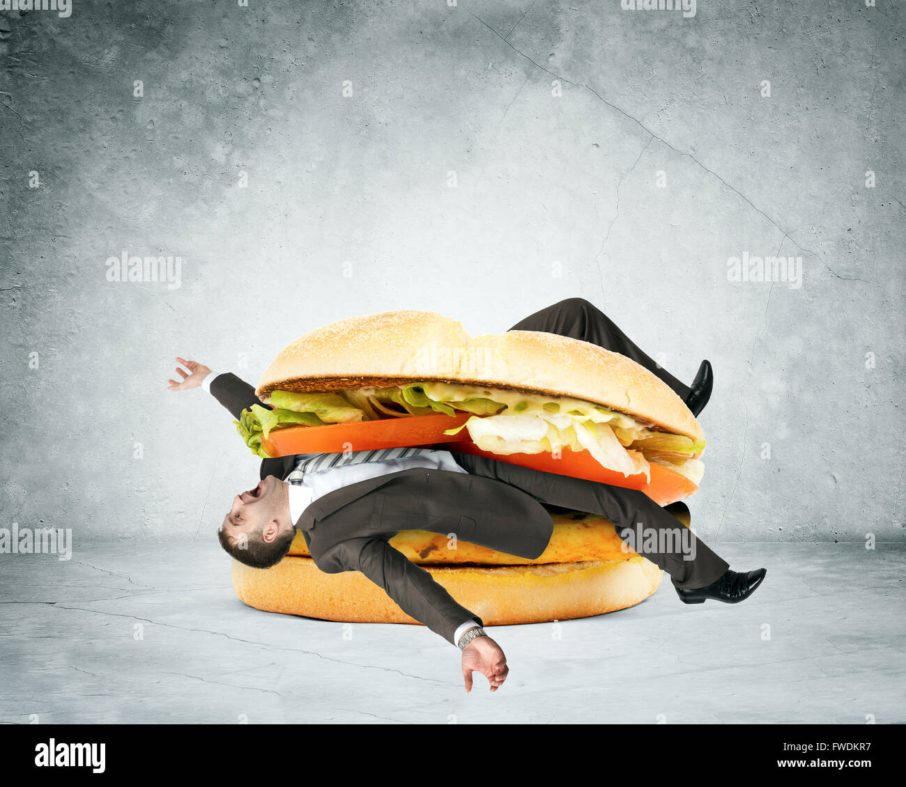 Businessman inside hamburger Stock Photo - Alamy