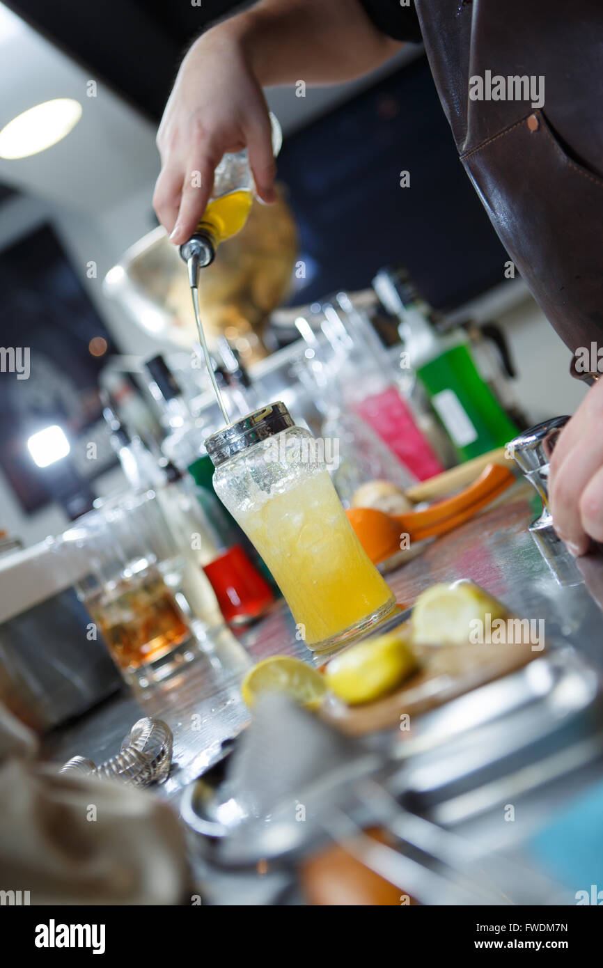 Bartender is straining cocktail in a glass Stock Photo - Alamy