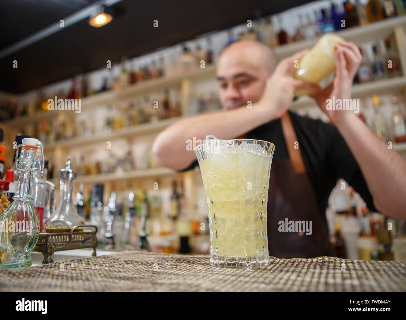 Barman shaking cocktail in bar hi-res stock photography and images - Alamy