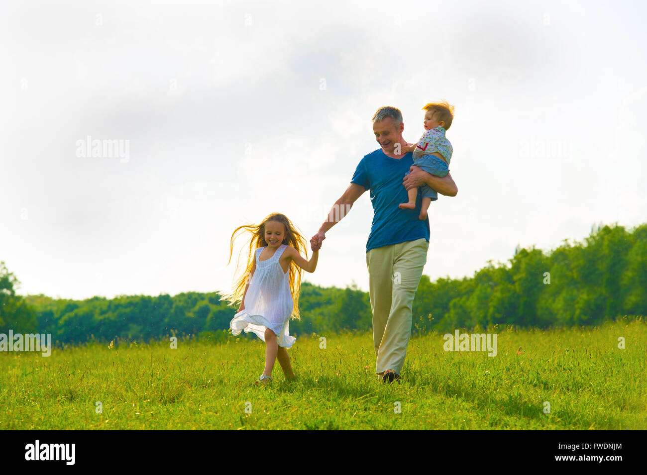 Dad with kids Stock Photo - Alamy