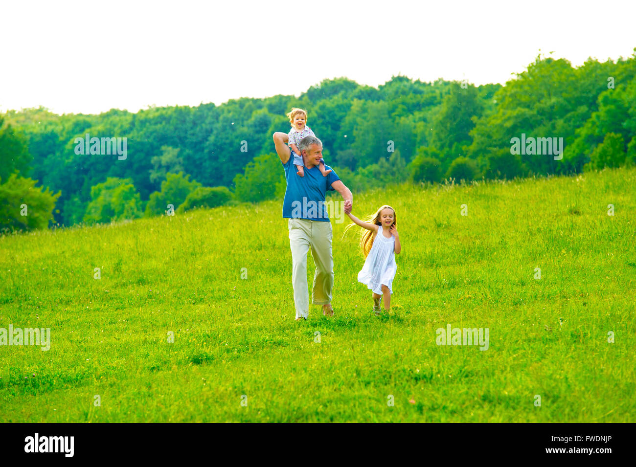 Family walk sunshine field hi-res stock photography and images - Alamy