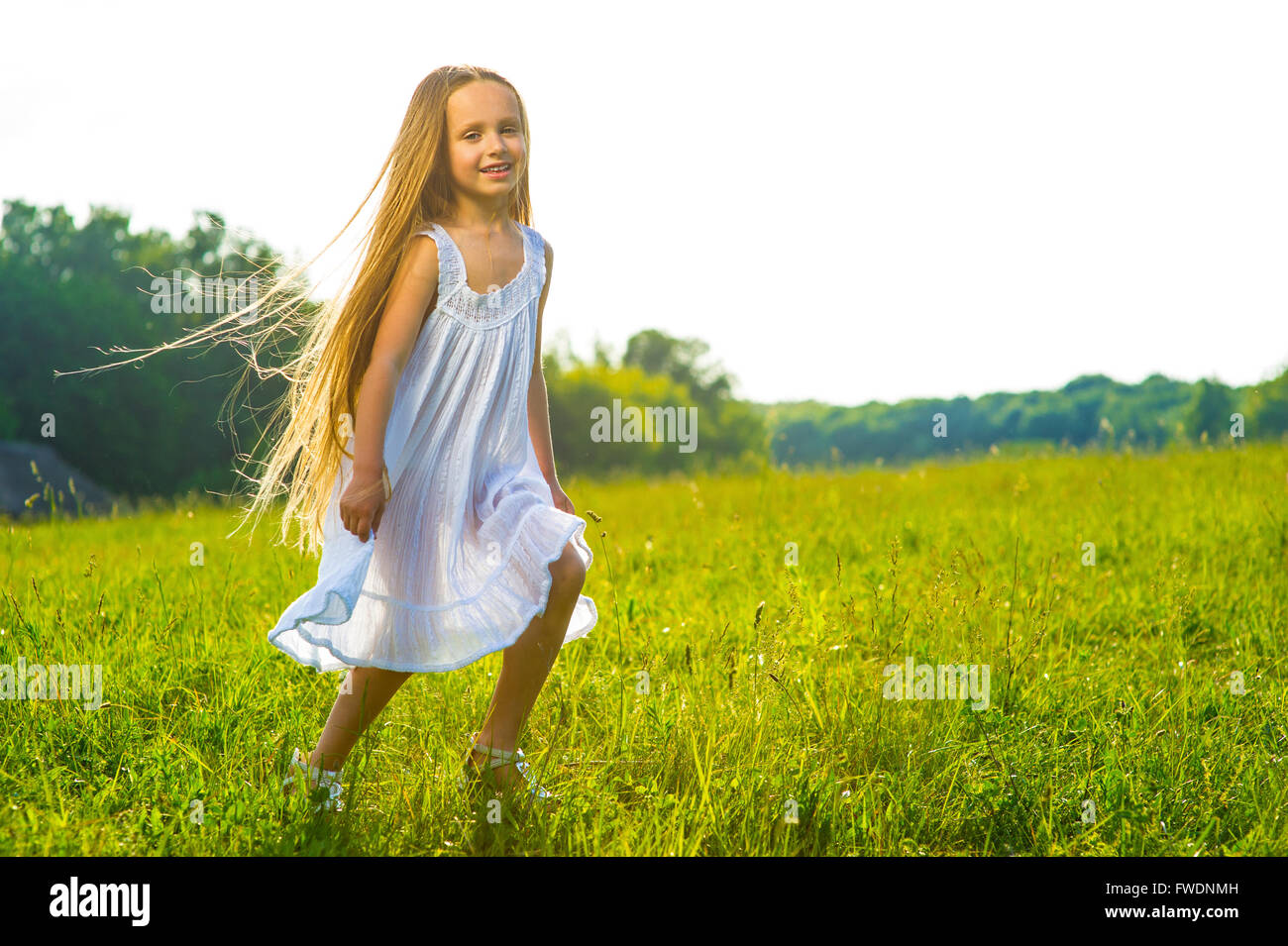 Girl ran across the lawn Stock Photo - Alamy