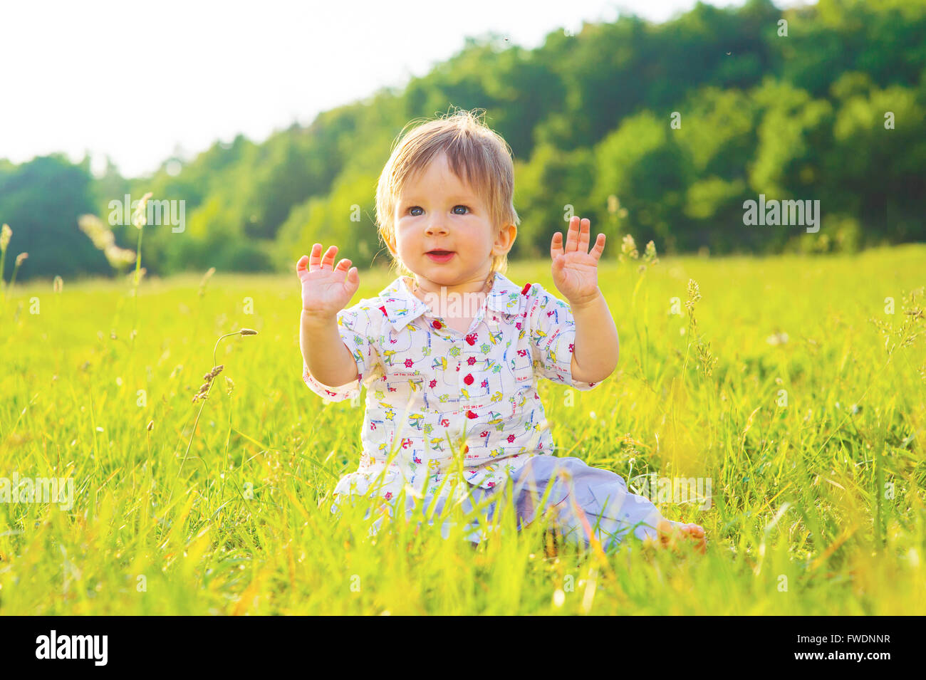 Baby enjoys life Stock Photo - Alamy