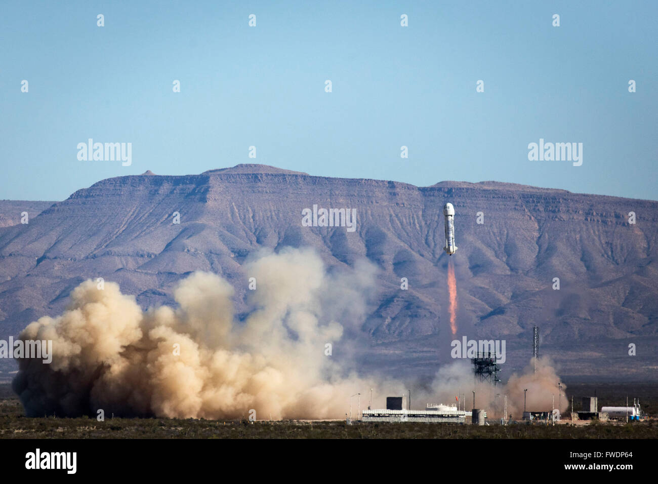 The Blue Origin New Shepard reusable rocket lifts off into space flying ...