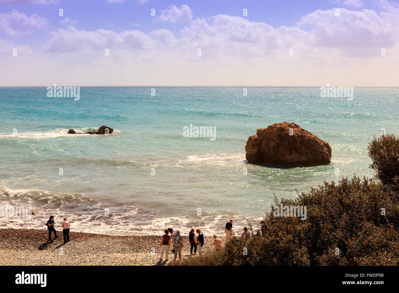 Tourists at the seaside by the Petra tou Romiou (Rock of the Greek ...