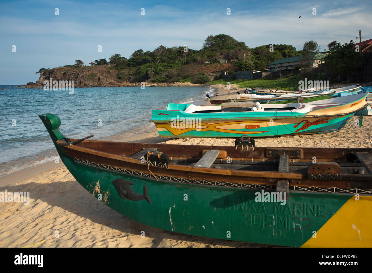 Sri Lanka, Trincomalee, Dutch Bay, colourful fishing boats on the beach ...
