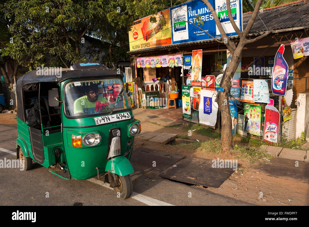 Sri Lanka, Trincomalee, Dockyard Road, auto-rickshaw outside Nilmini stores, shop Stock Photo ...