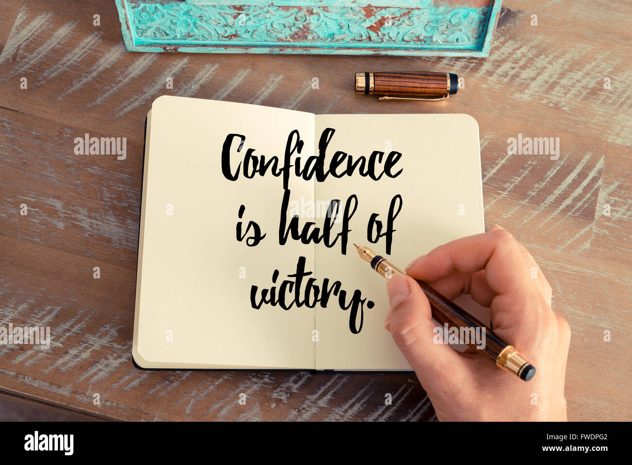 Retro effect and toned image of a woman hand writing on a notebook ...