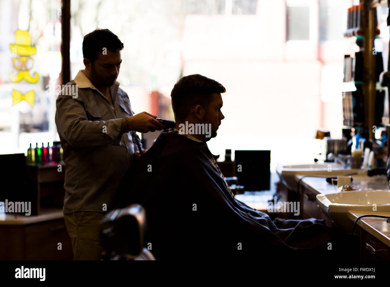 Turkish barber working in white man beard Stock Photo - Alamy