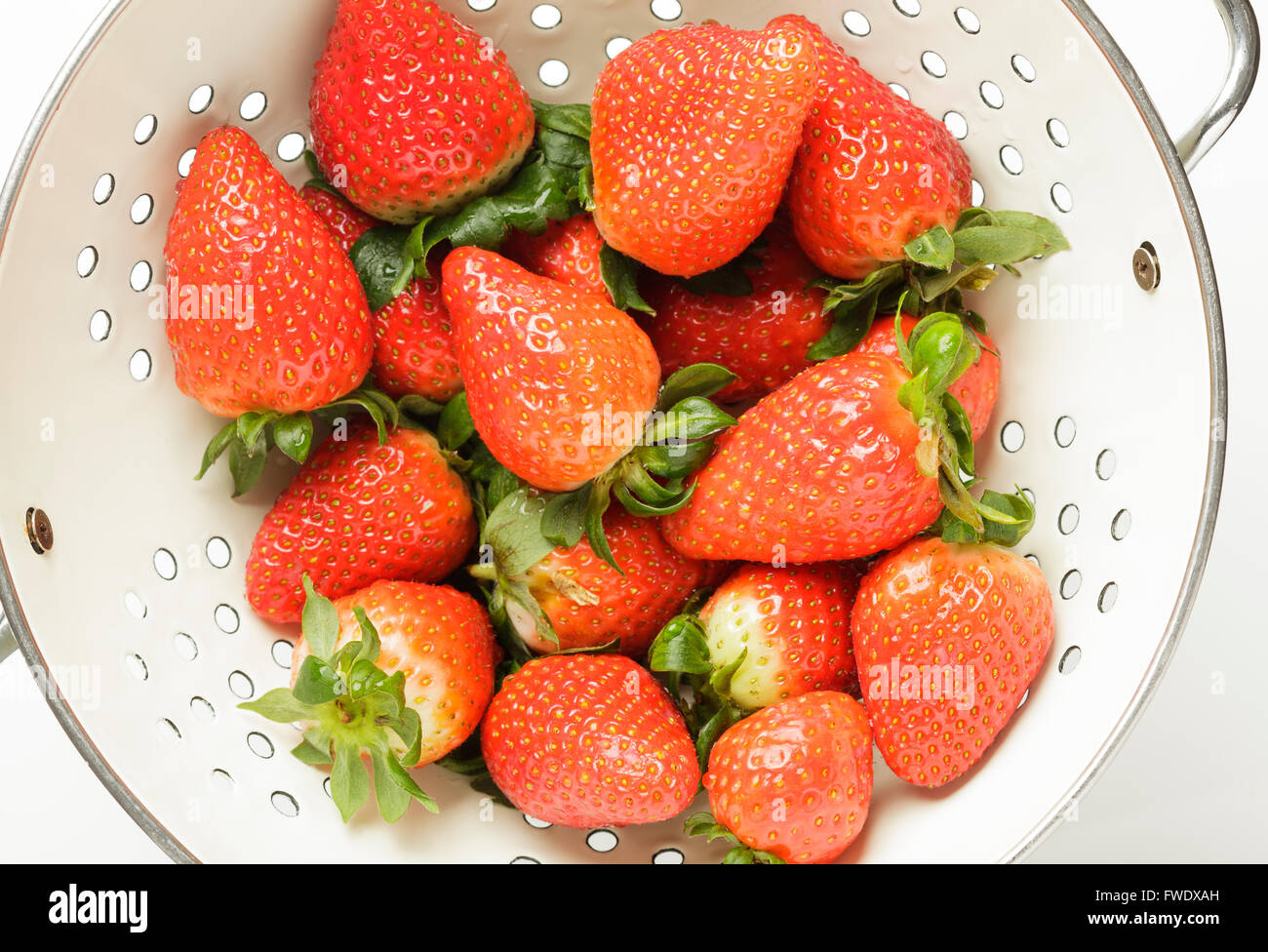 Strawberry in a colander hi-res stock photography and images - Alamy