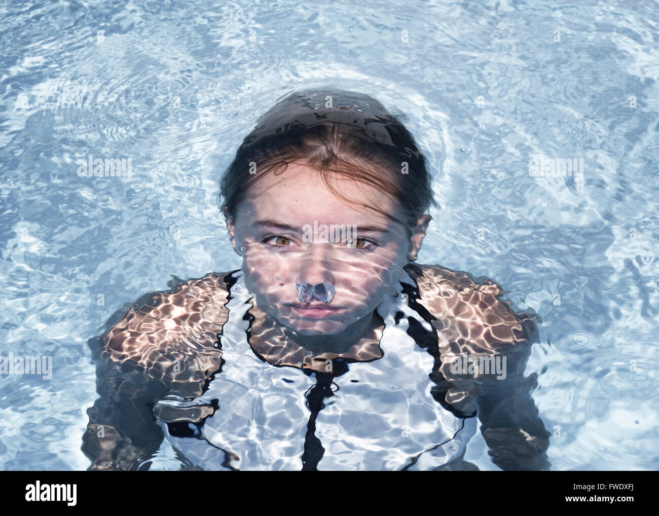 Young woman underwater in a swimming pool Stock Photo - Alamy