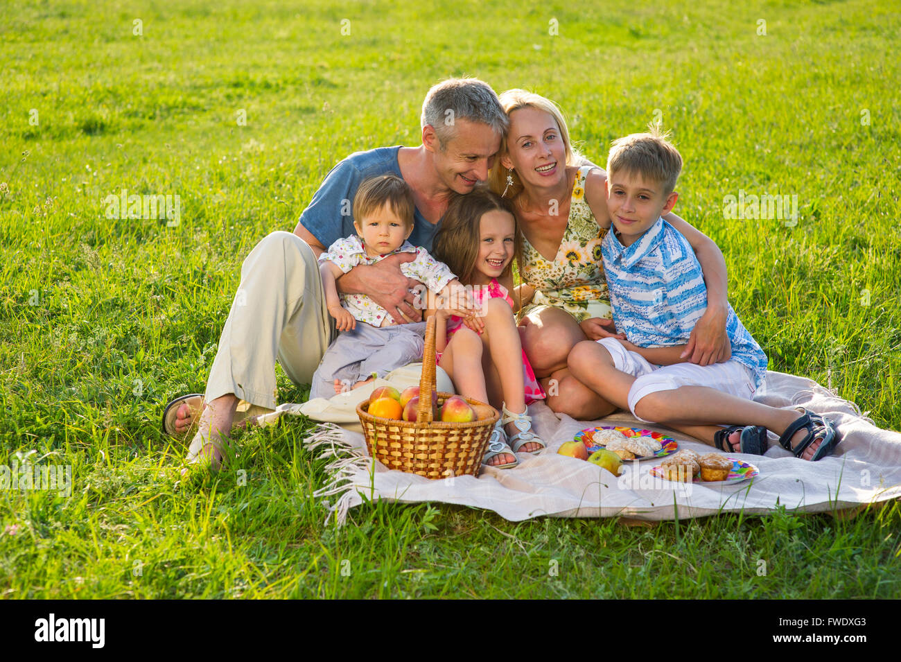 Happy family resting at the weekend Stock Photo - Alamy