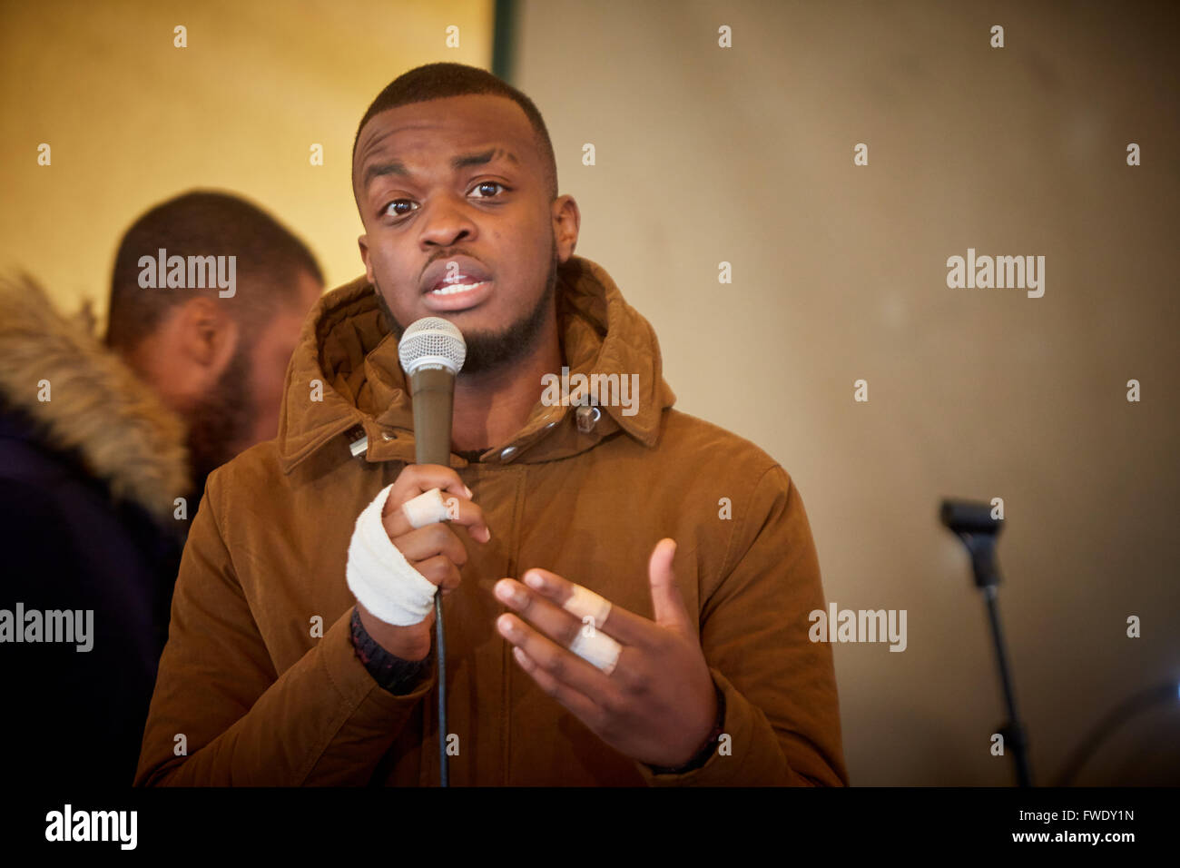 George the poet performing on stage Stock Photo - Alamy