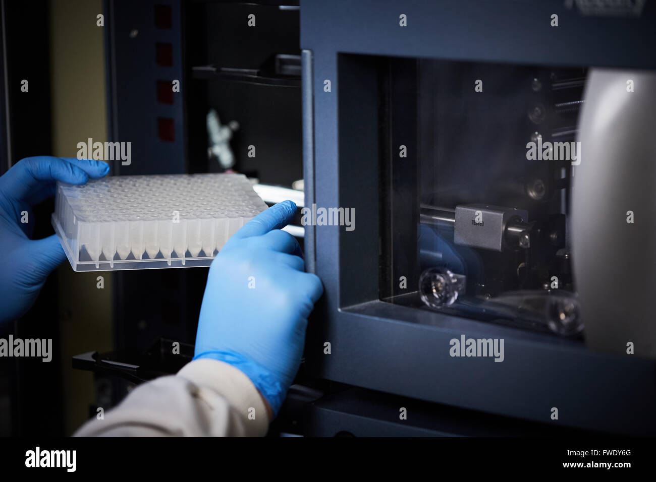 well plate loaded into testing machine analysing biology analyser blood ...