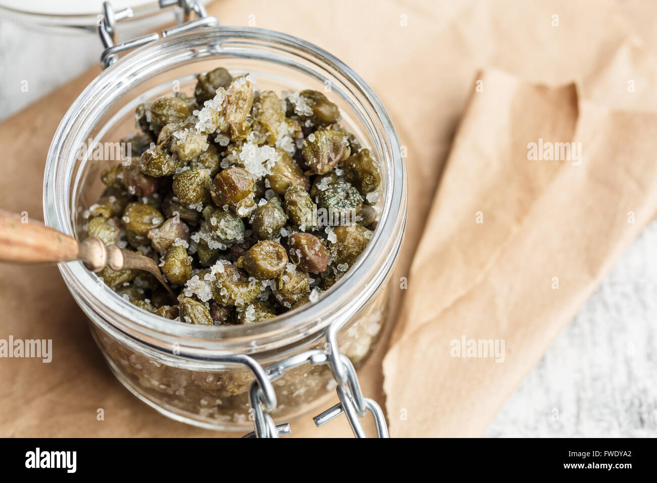 Salted capers in glass jar Stock Photo - Alamy