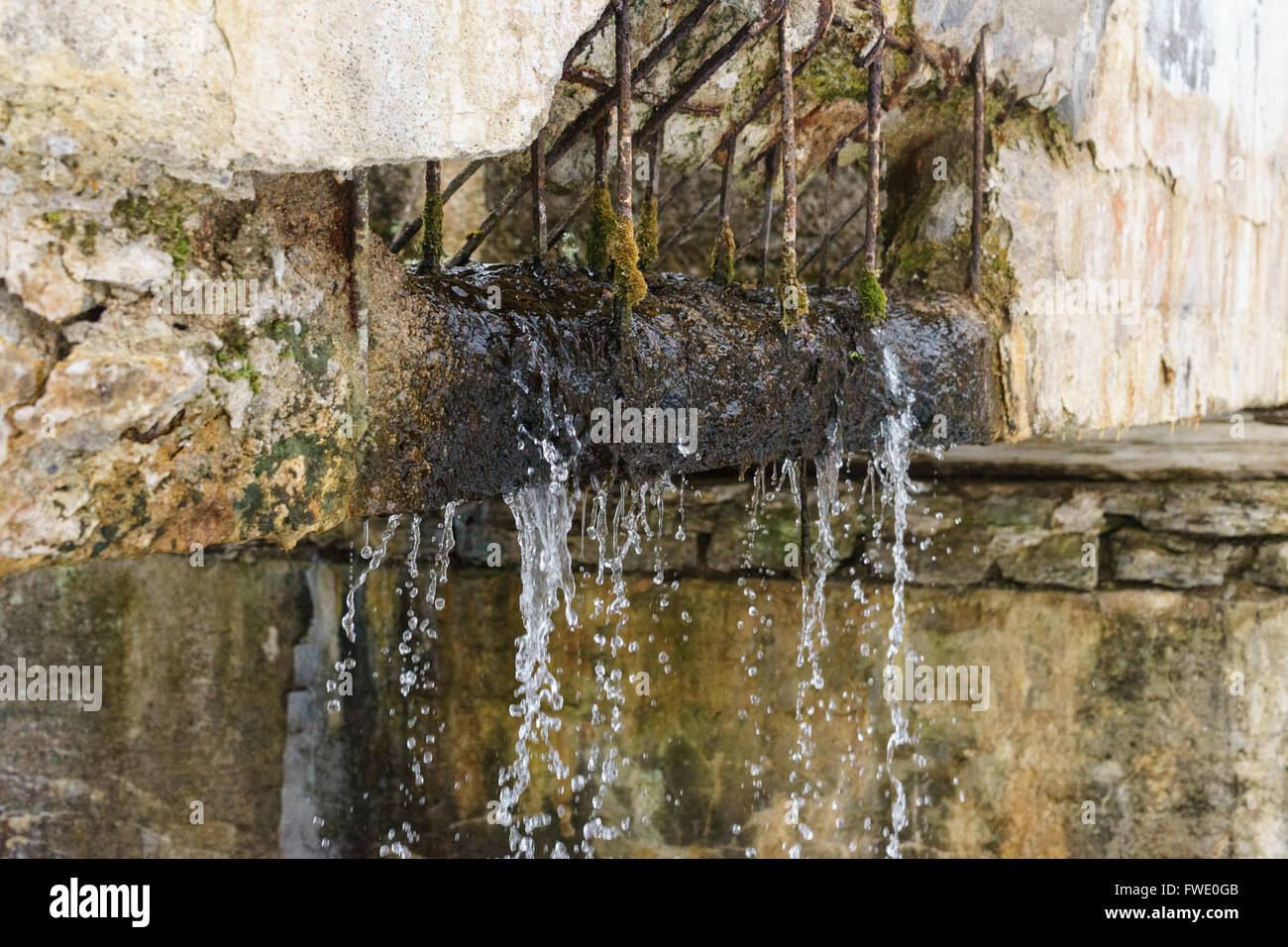 Falling and dripping water from old industrial construction Stock Photo ...