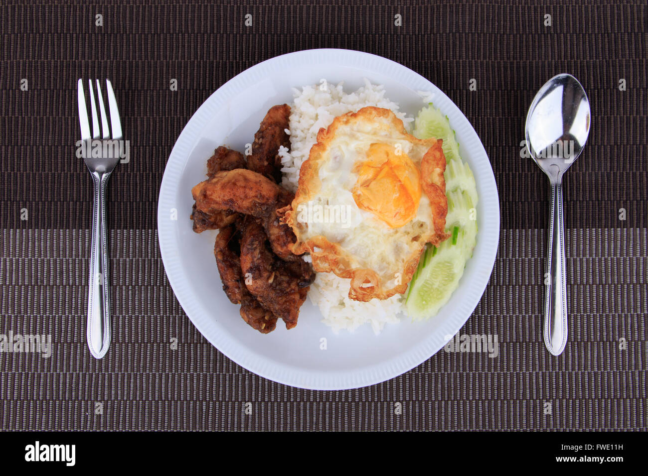 Fried red tilapia or pomegranate fish with garlic and pepper with sunny ...