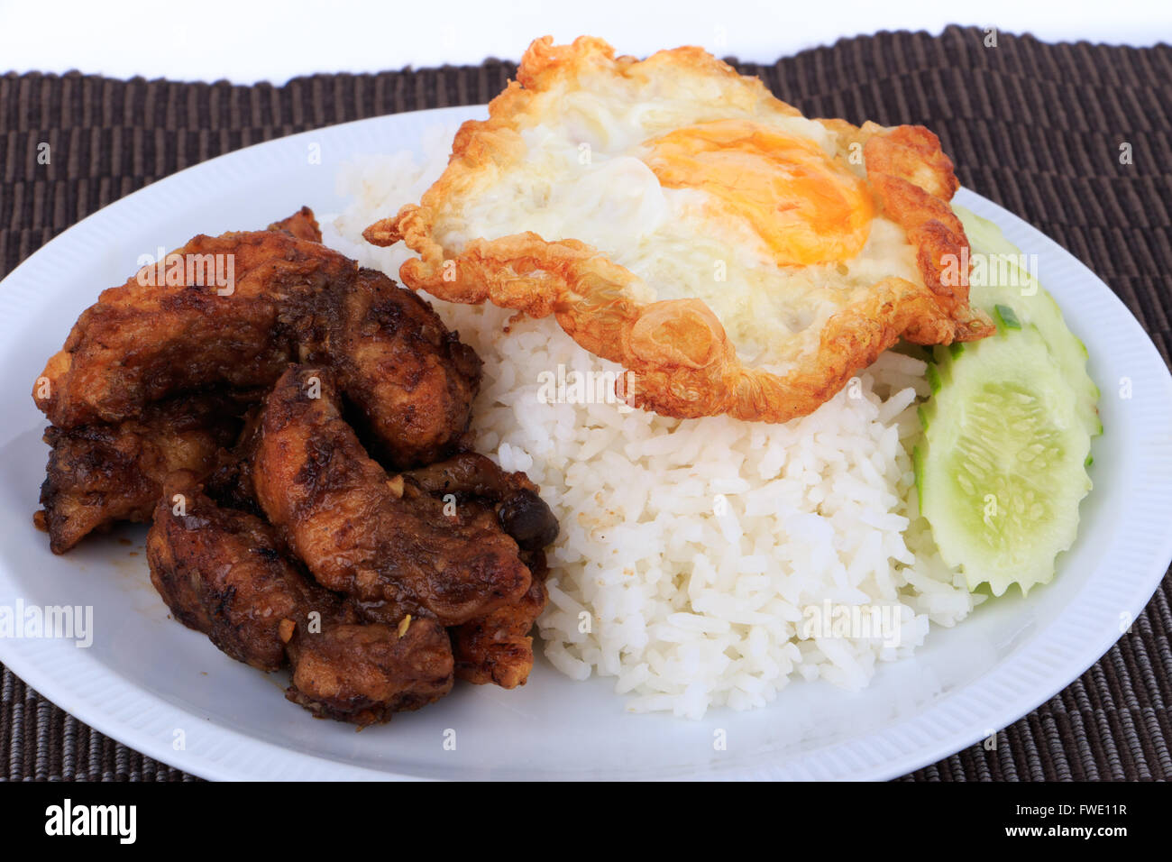 Fried red tilapia or pomegranate fish with garlic and pepper with sunny ...