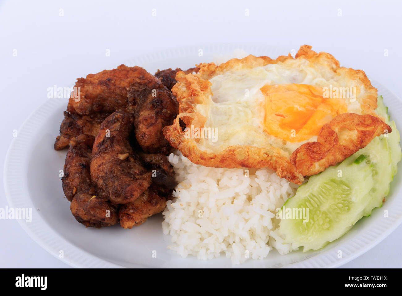 Fried red tilapia or pomegranate fish with garlic and pepper with sunny ...