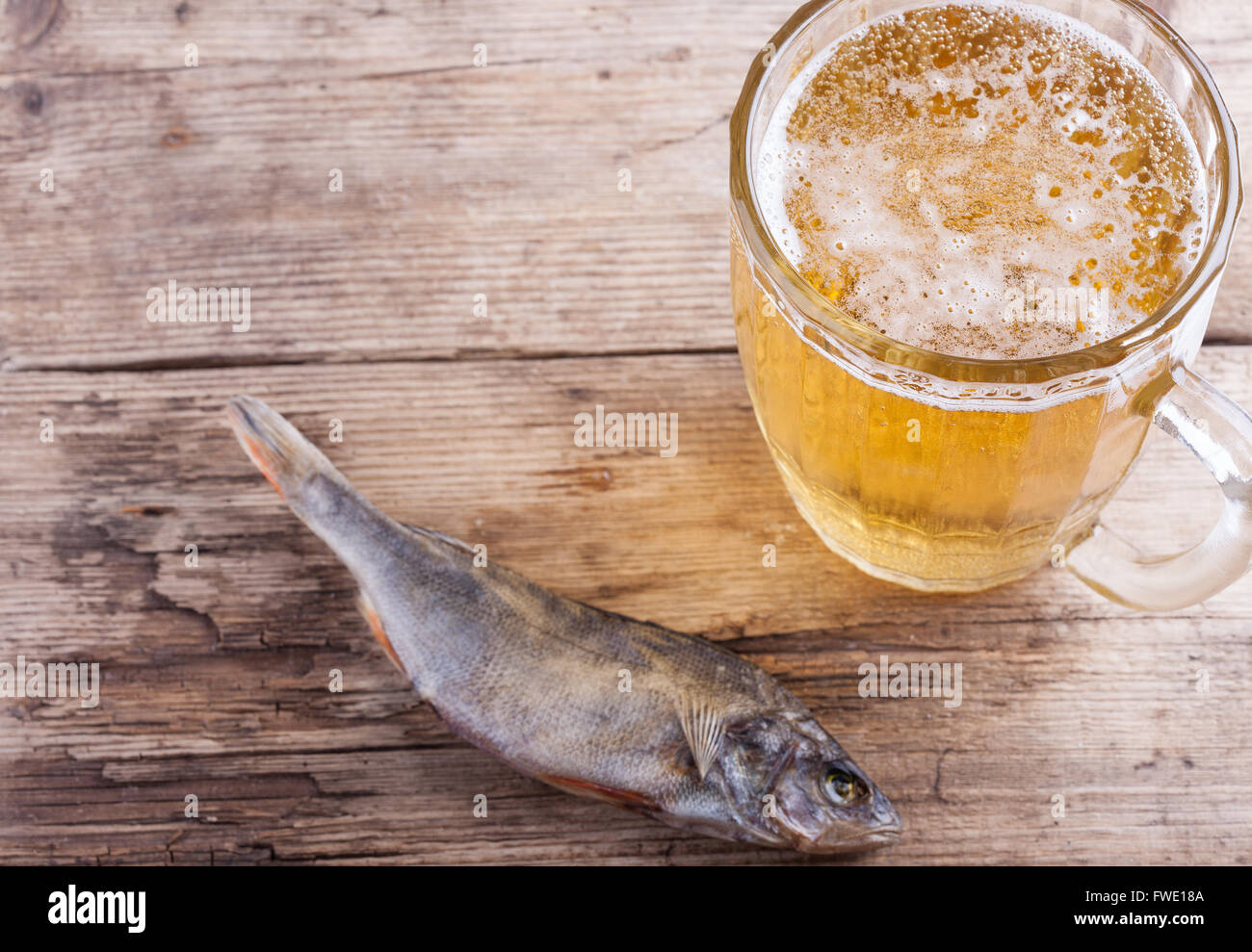 dried fish with beer on the table background Stock Photo - Alamy