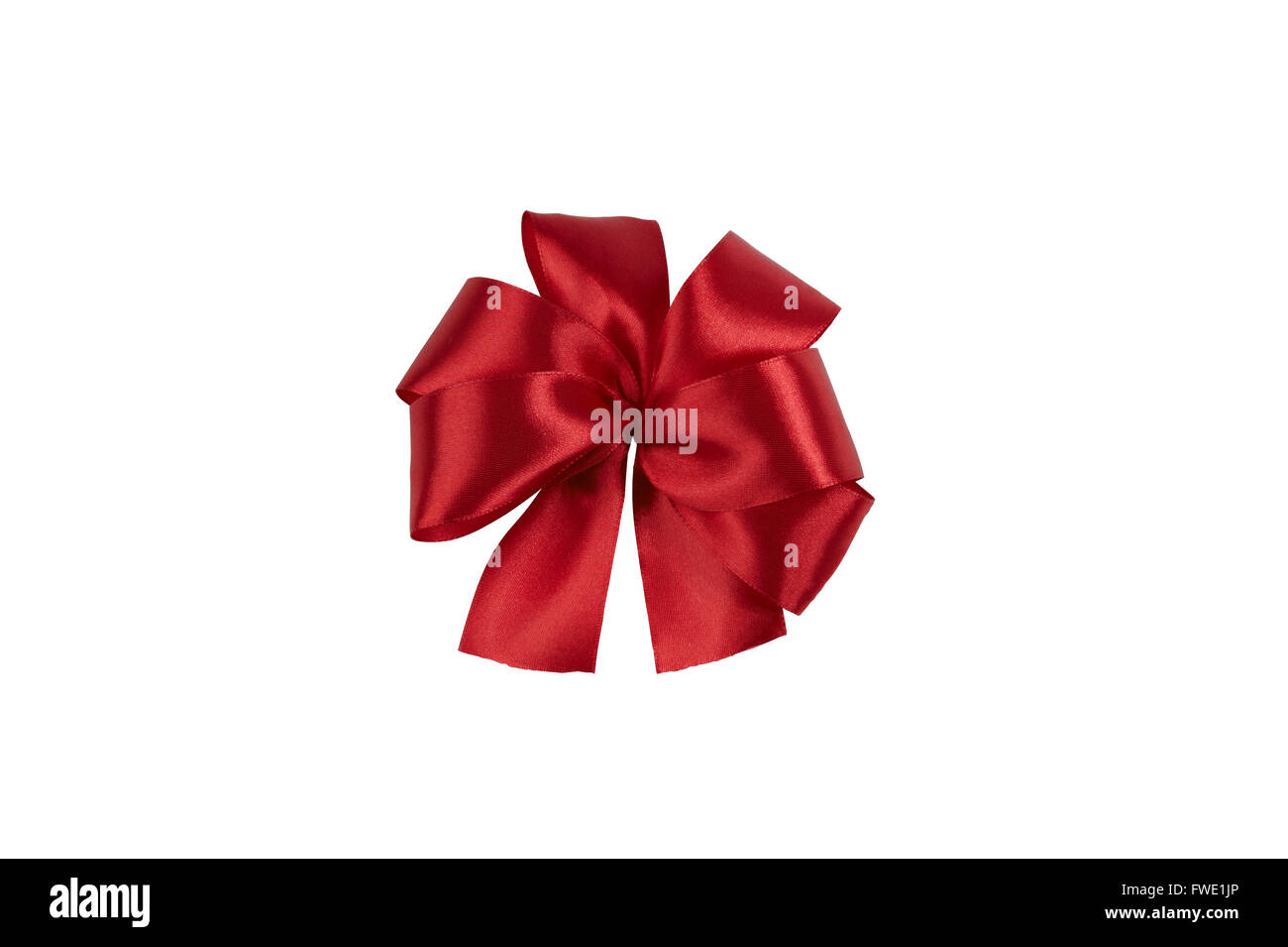 Red satin bow flower shaped in the center of picture. Isolated on white ...