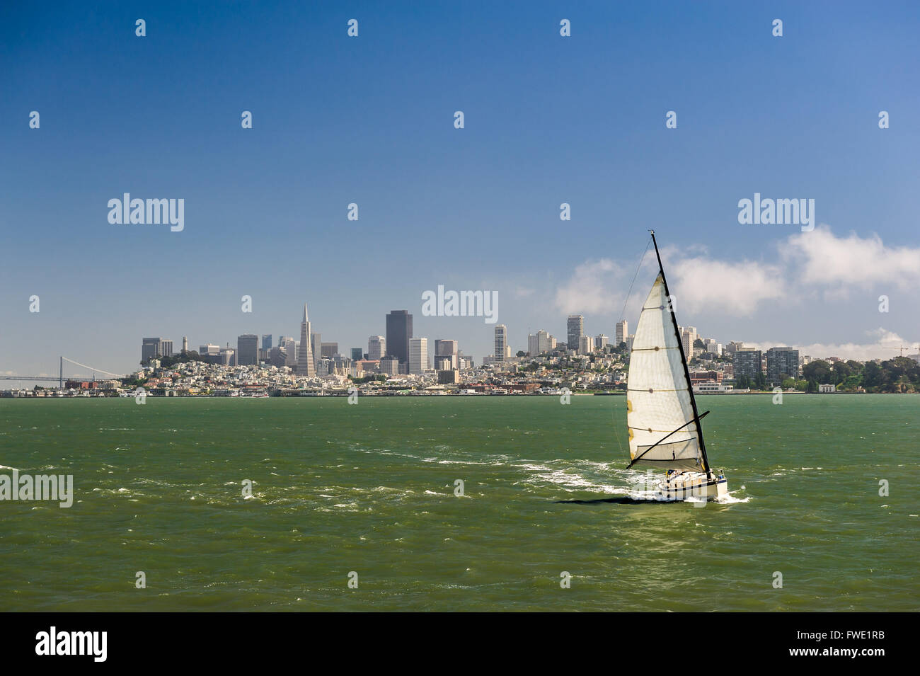 Yacht sailing in seas of metropolitan city Stock Photo - Alamy