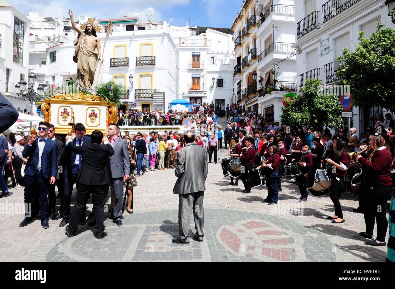 Easter procession arriving at the crowded Plaza of Competa Village ...