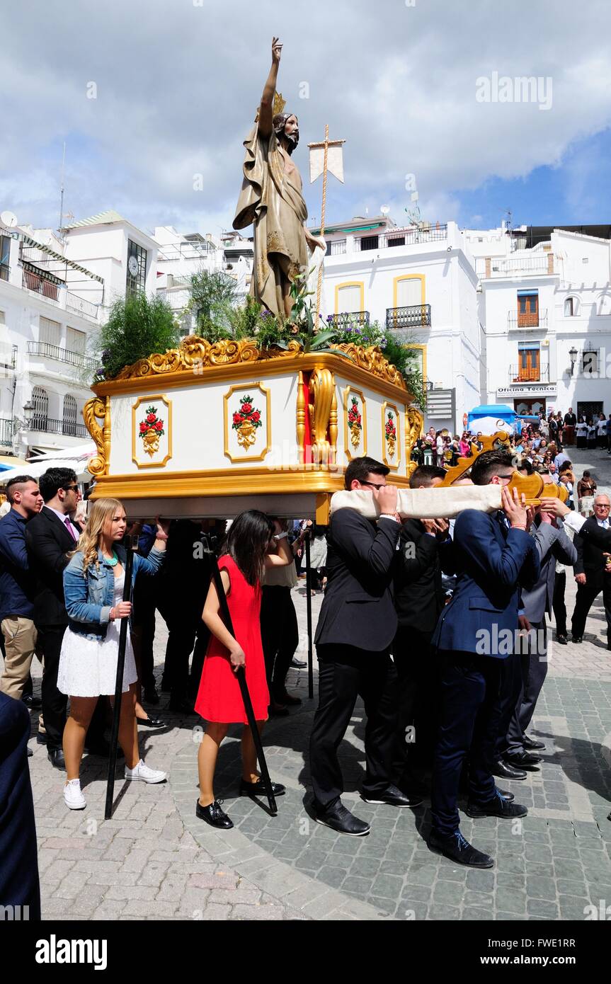 Easter procession arriving at the crowded Plaza of Competa Village ...