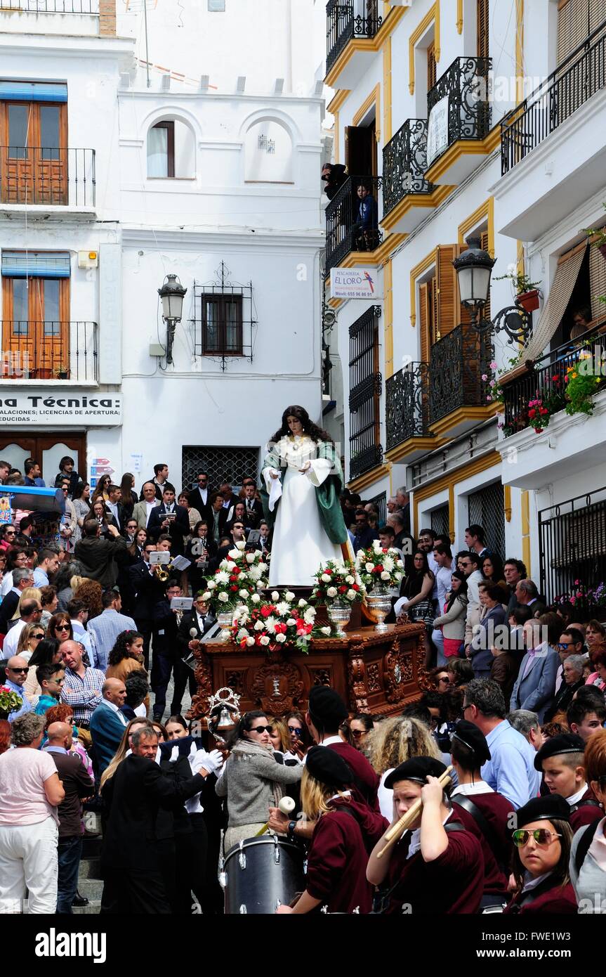 Easter procession arriving at the crowded Plaza of Competa Village ...