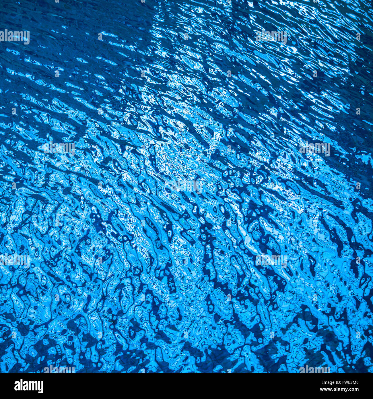 Swimming pool water surface with light reflections Stock Photo - Alamy