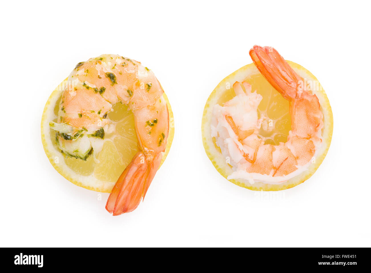 Cooked shrimp on lemon slice on white background top view. Culinary ...